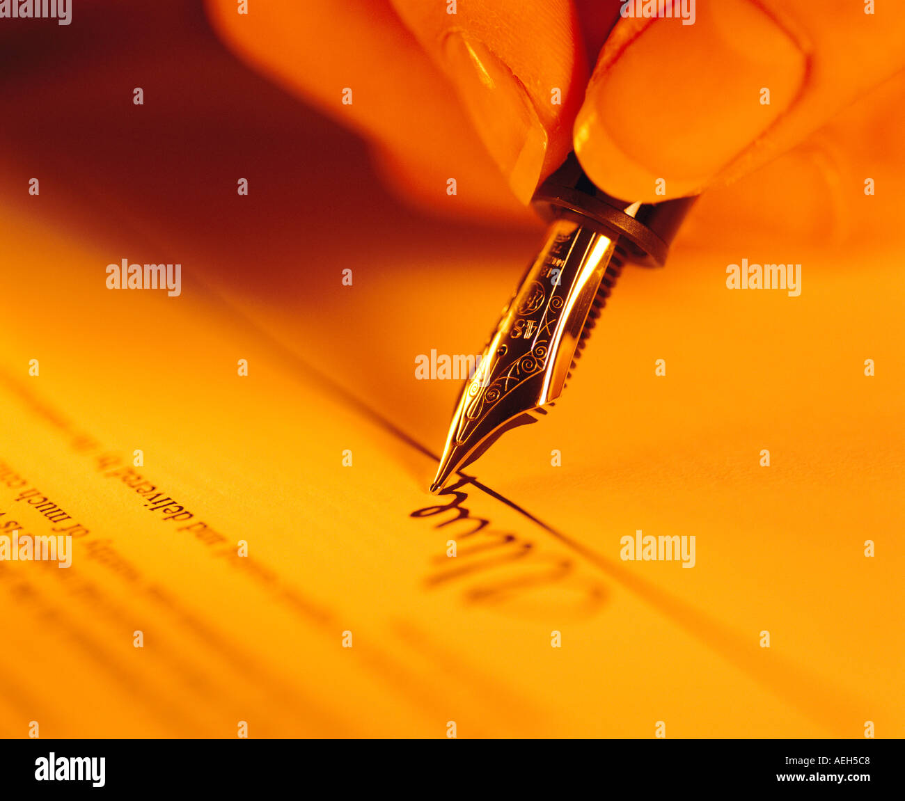 hand holding fountain pen signing contract Stock Photo - Alamy