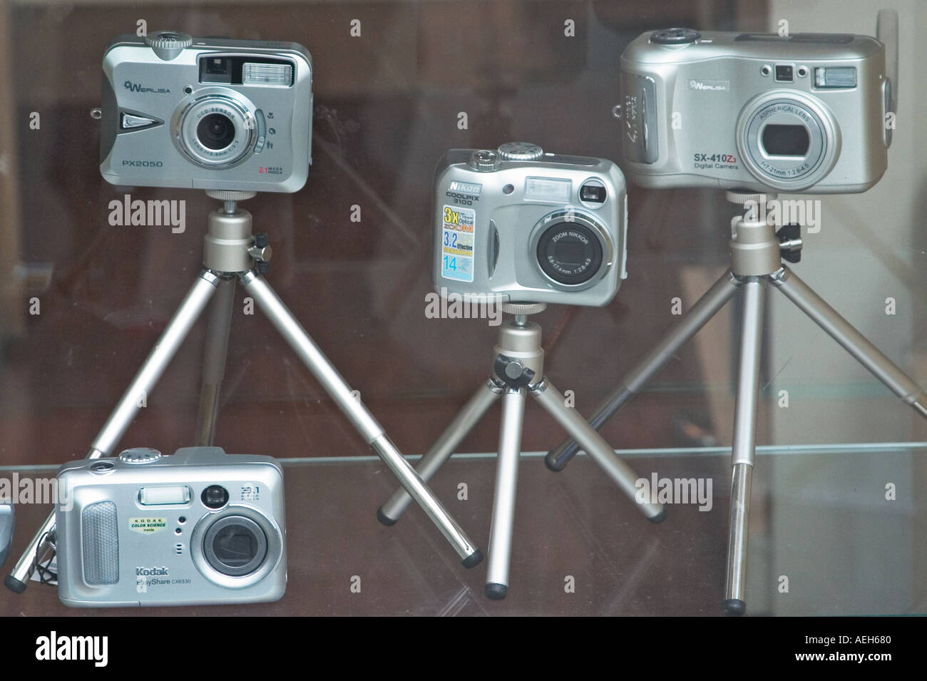 Digital cameras in shop window Stock Photo - Alamy
