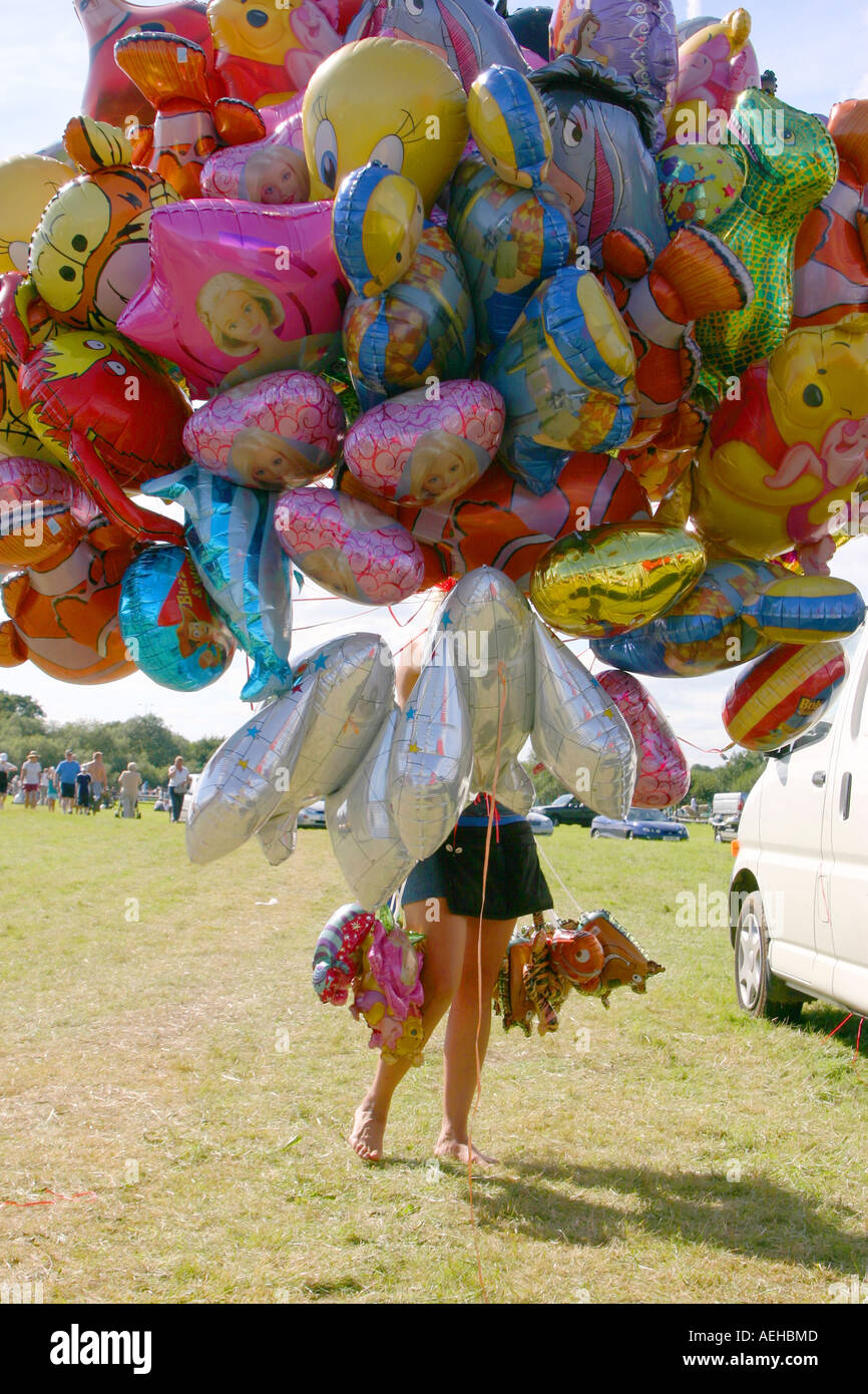 Girl selling balloons Stock Photo - Alamy