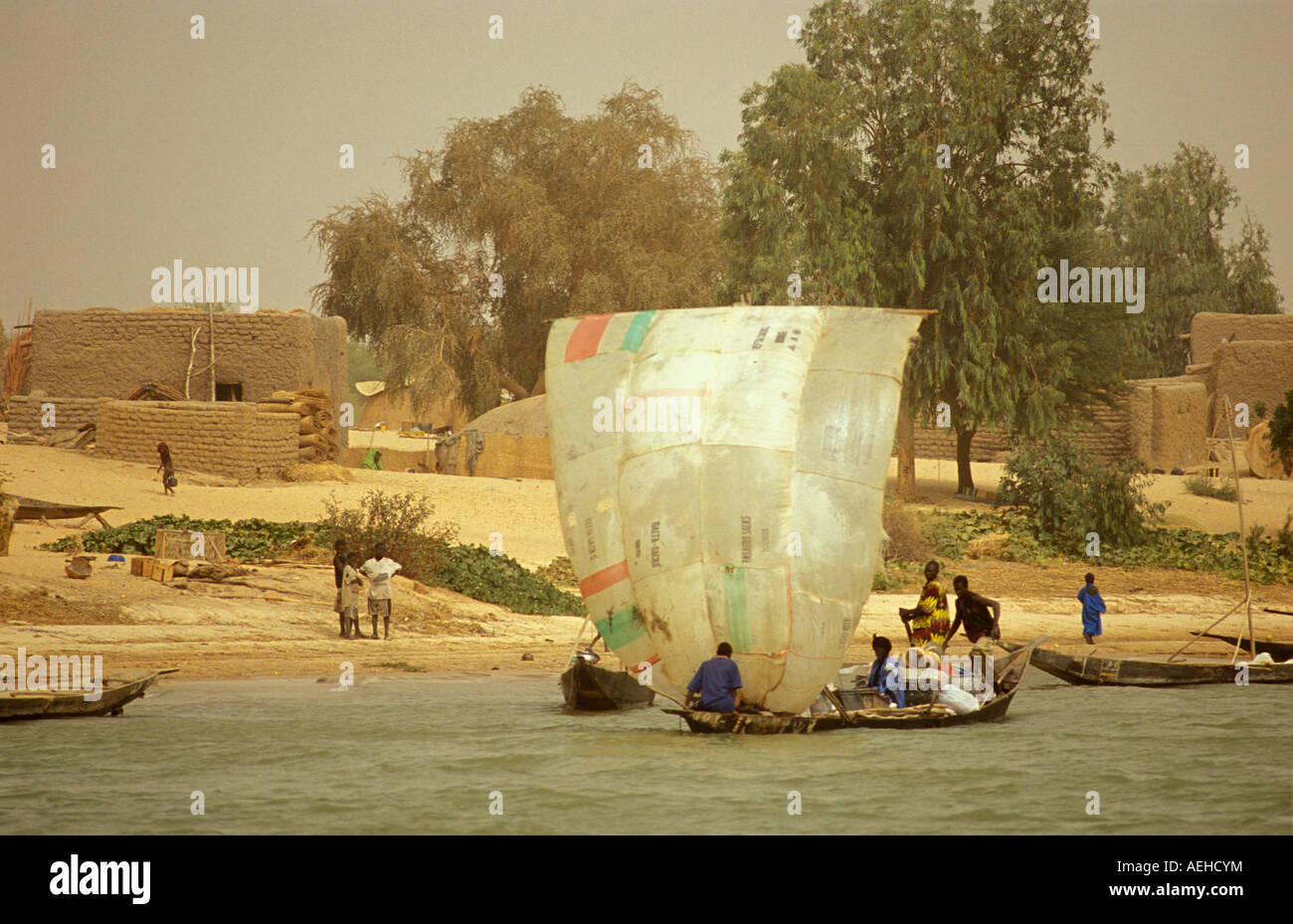 Mali Bamba, People of Songrai tribe crossing Niger river in canoe with ...