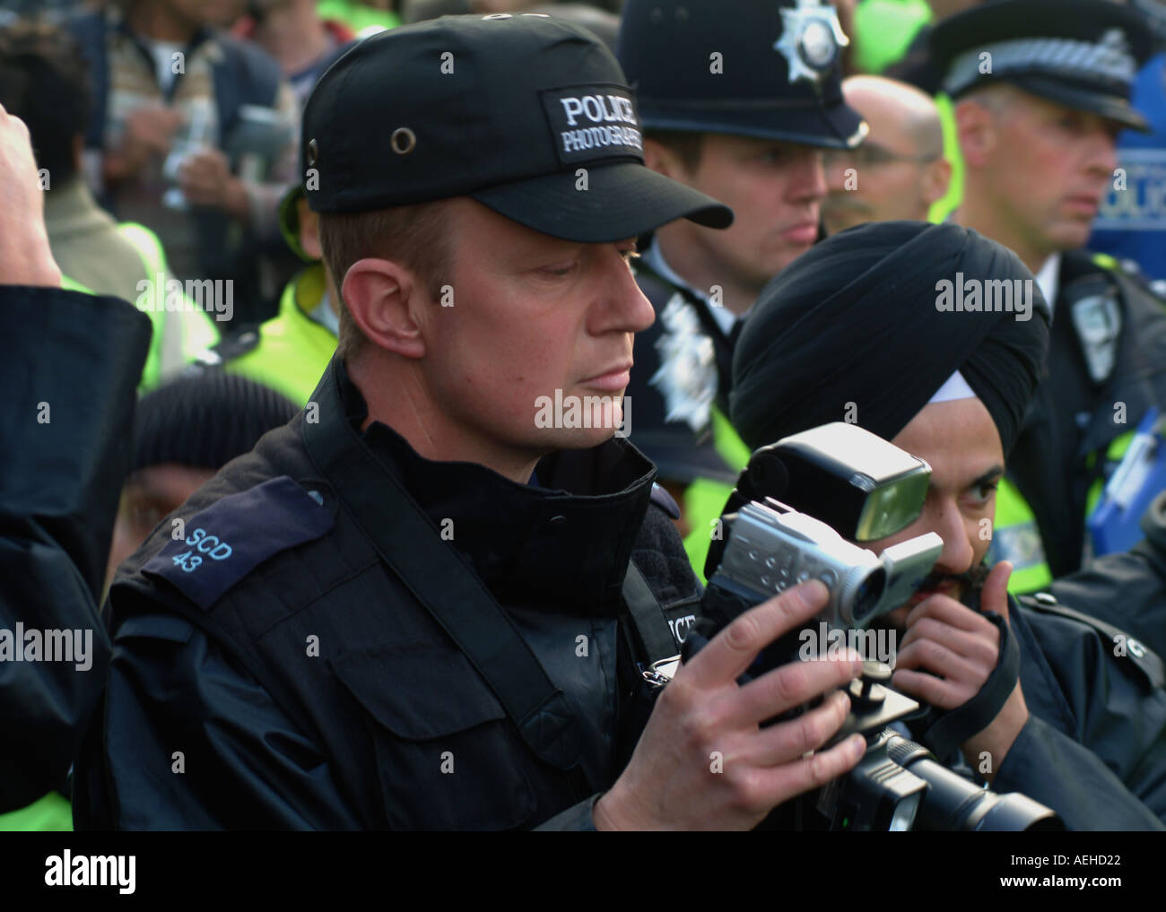 Police cameraman on duty Stock Photo - Alamy