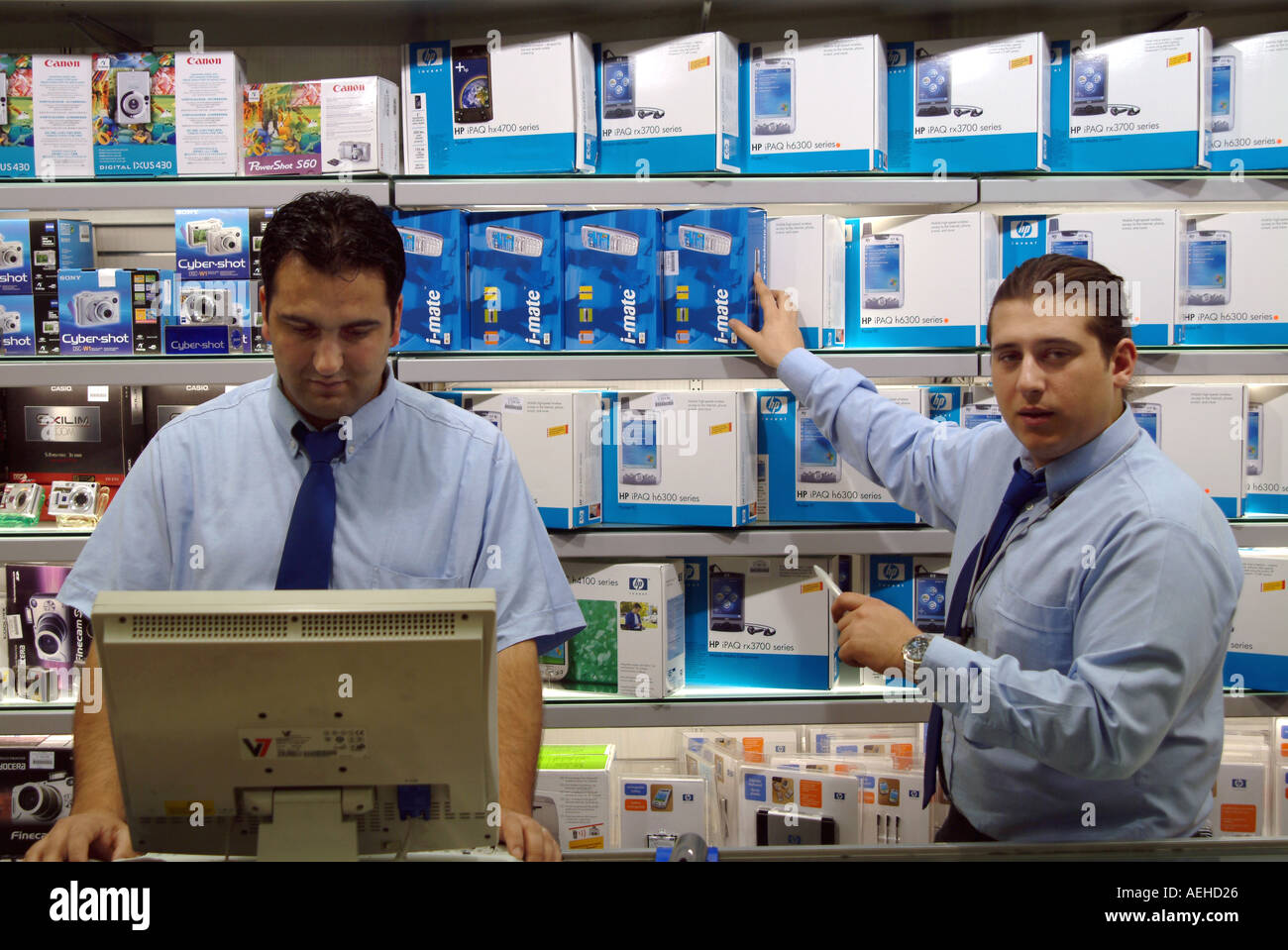 PDA shop two sales assistant Stock Photo - Alamy