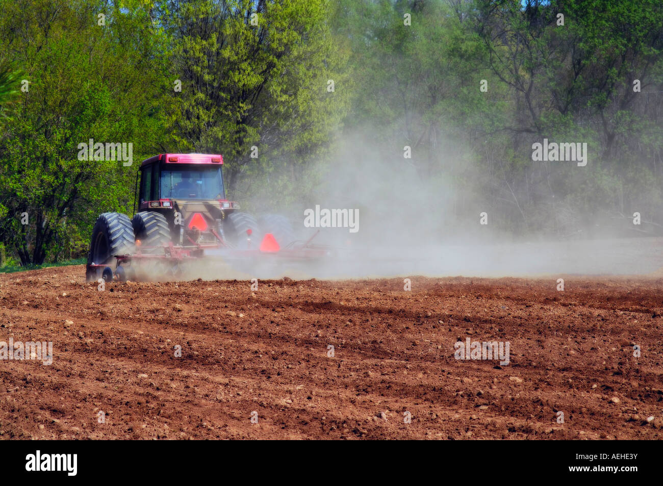 tractor plowing soil Stock Photo - Alamy