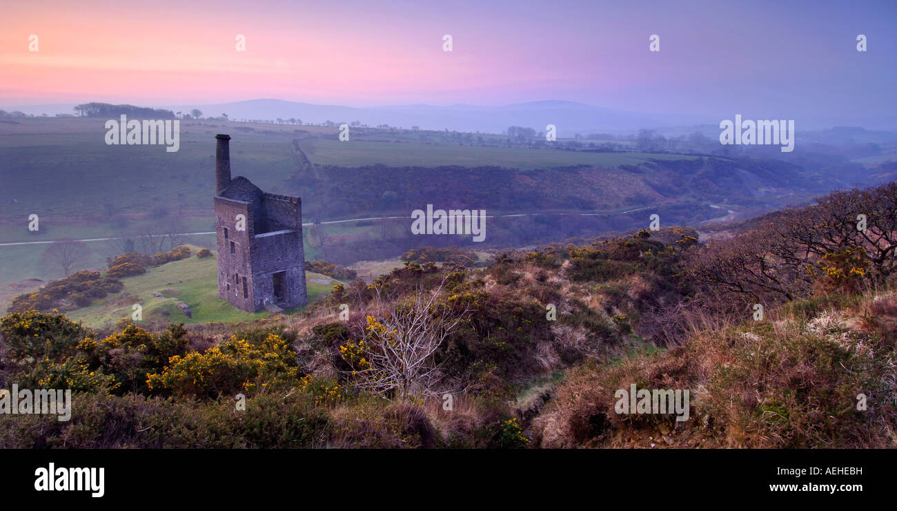 Derelict mine engine Wheal Betsy near Tavistock with the orange glow of ...