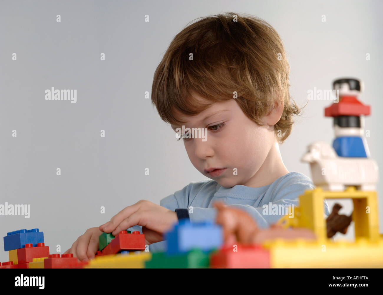 Boy playing with LEGO bricks Stock Photo - Alamy
