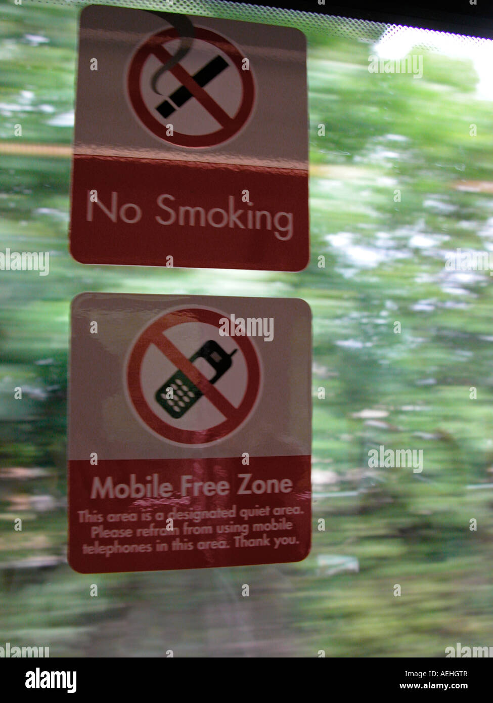 no smoking and mobile free zone signs in a South West Train speeding ...