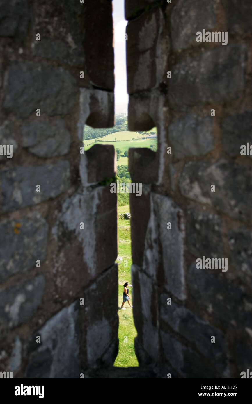 A tourist comes into view through a narrow arrow defence window at ...