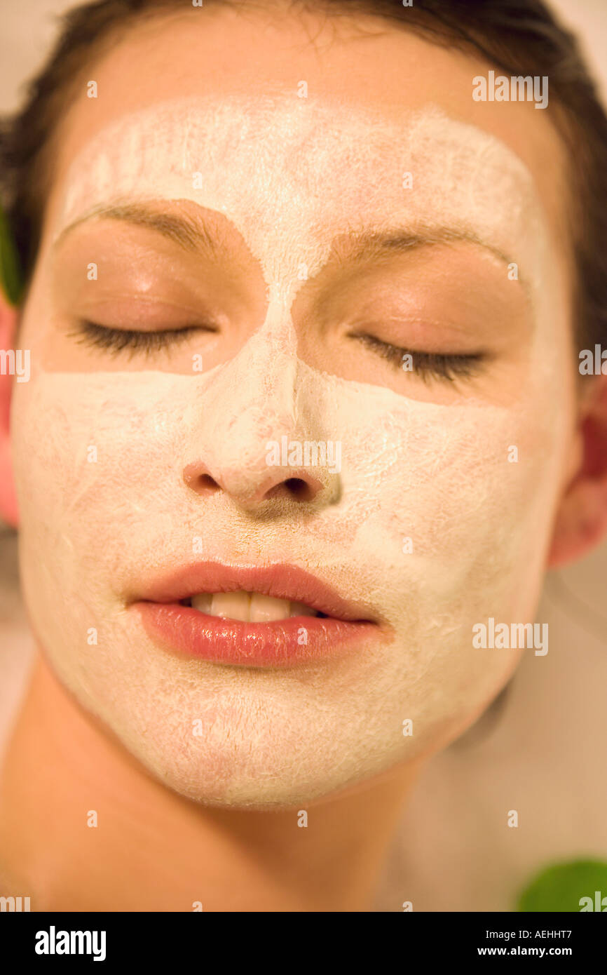 Young woman with face mask, eyes closed Stock Photo - Alamy