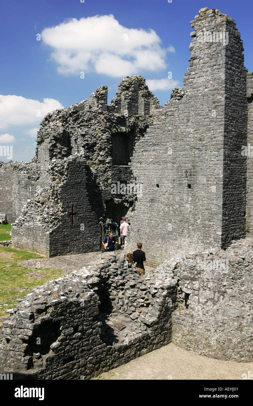 Tourists visit the courtyard ruins of famous Welsh tourist attraction ...