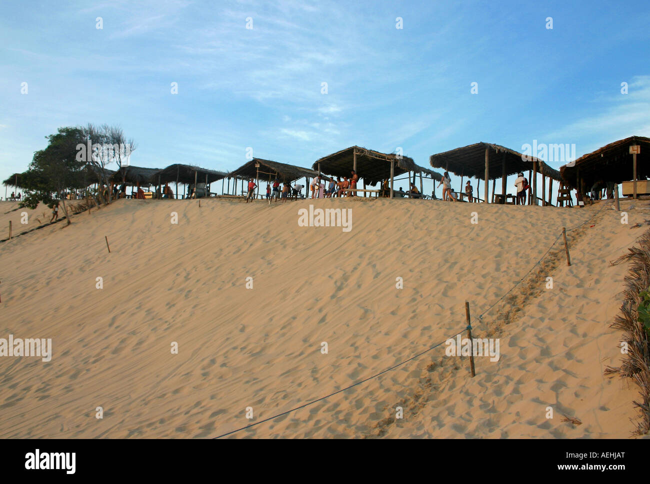 sand dune with huts on top Stock Photo - Alamy