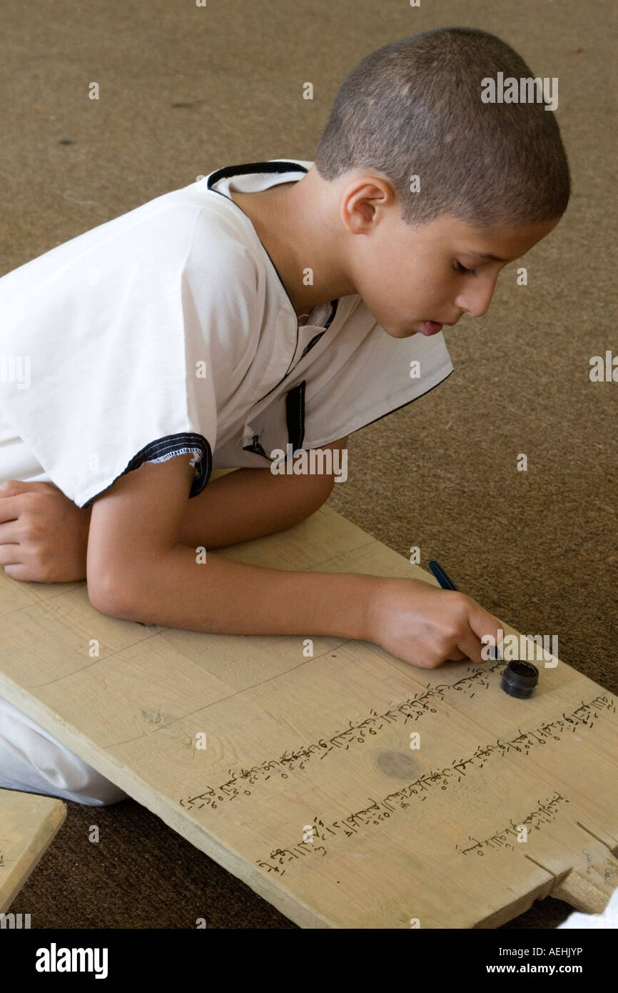 Zliten, Libya, Madrasa. Boy Writing Koranic Verses on his Prayer Board ...