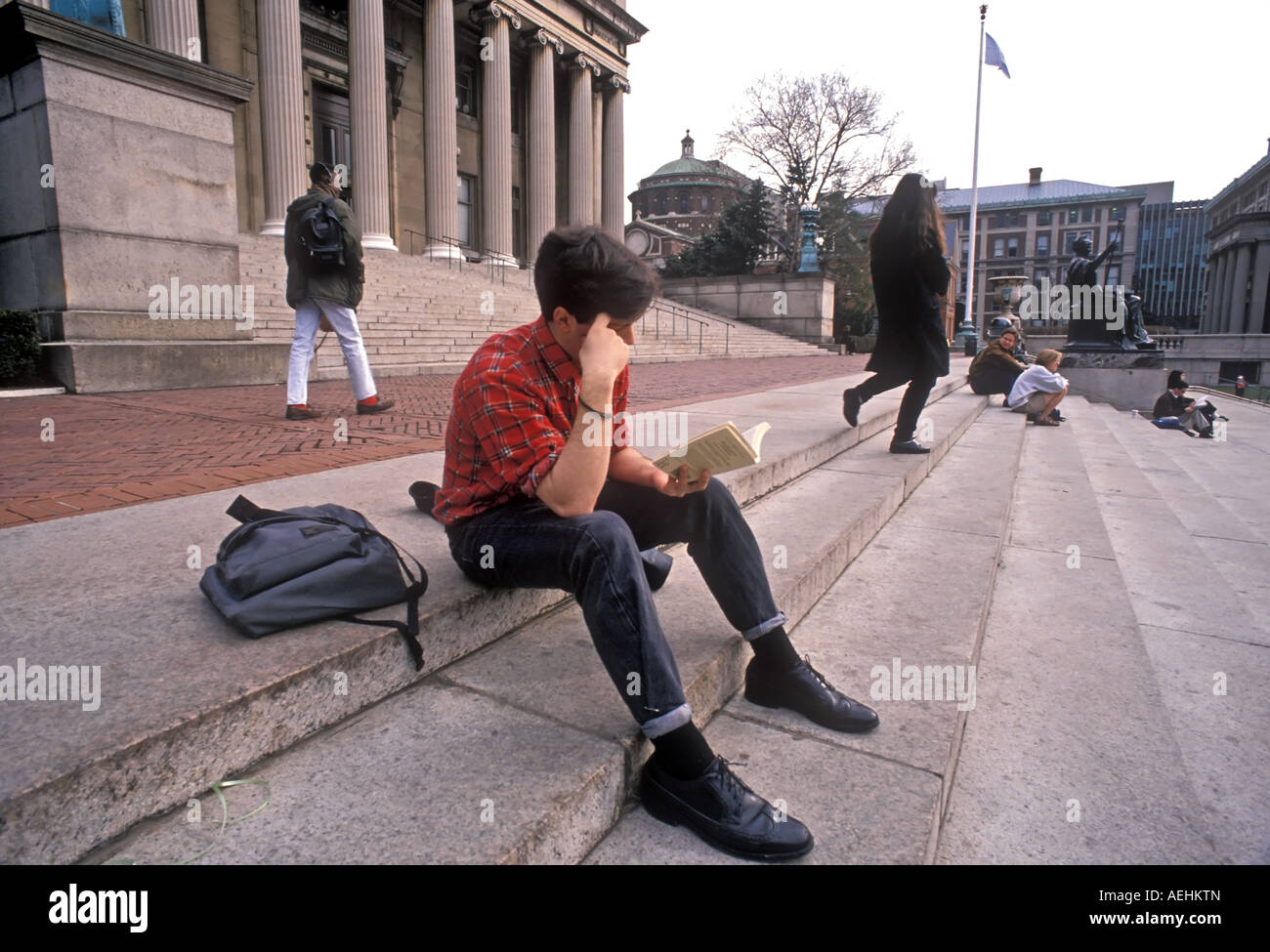 Student reading on the steps of Columbia University's library in New ...