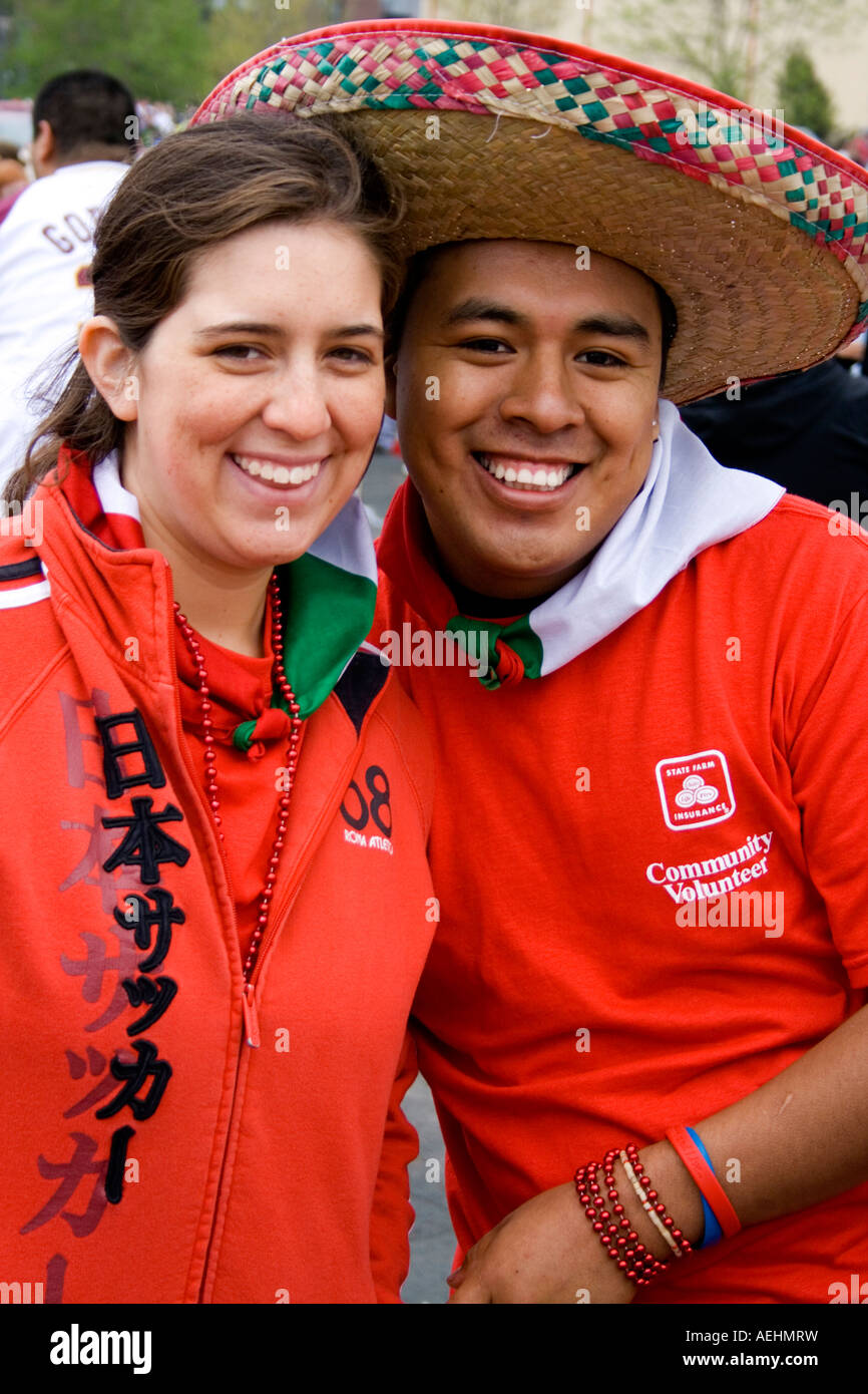 Two happy members of the State Farm Community Volunteer team parade ...