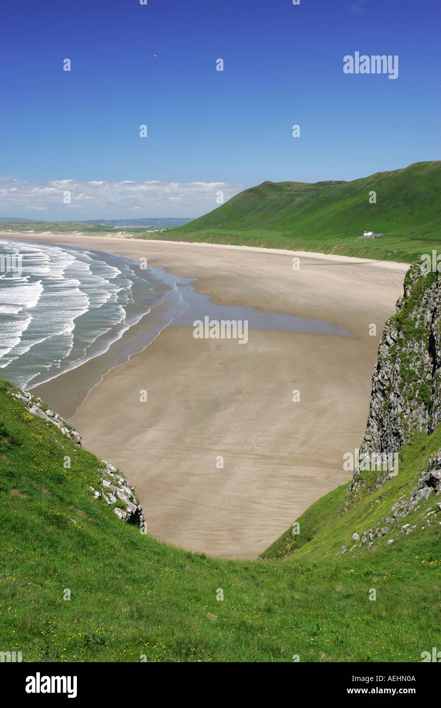 Lush green cliff tops overlooking famous Rhossili bay beach and downs ...