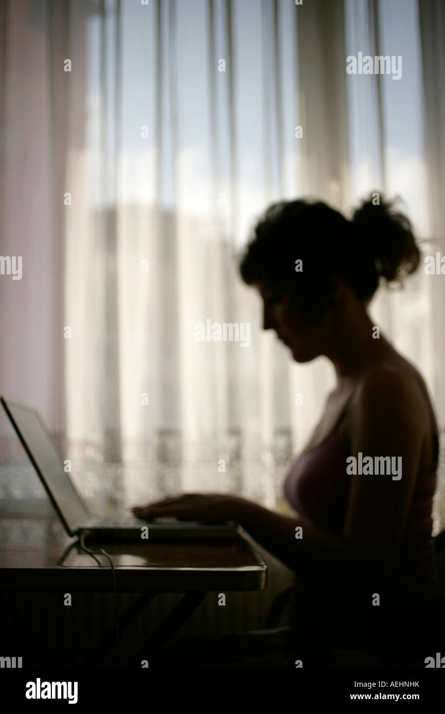 Working from home on tan Apple laptop Stock Photo - Alamy