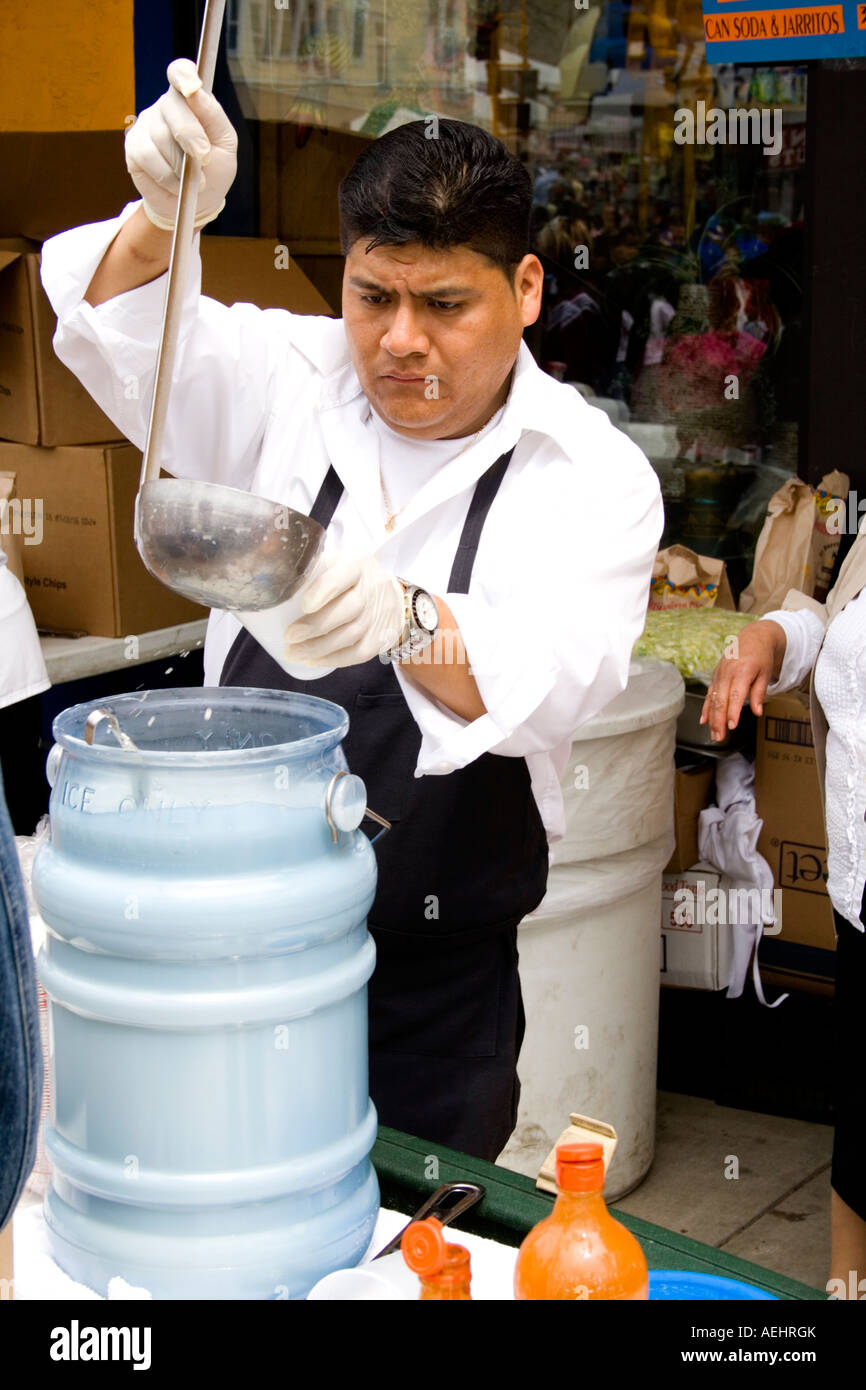 Latino man age 26 pouring a Mexican delicacy. Cinco de Mayo Fiesta. "St ...