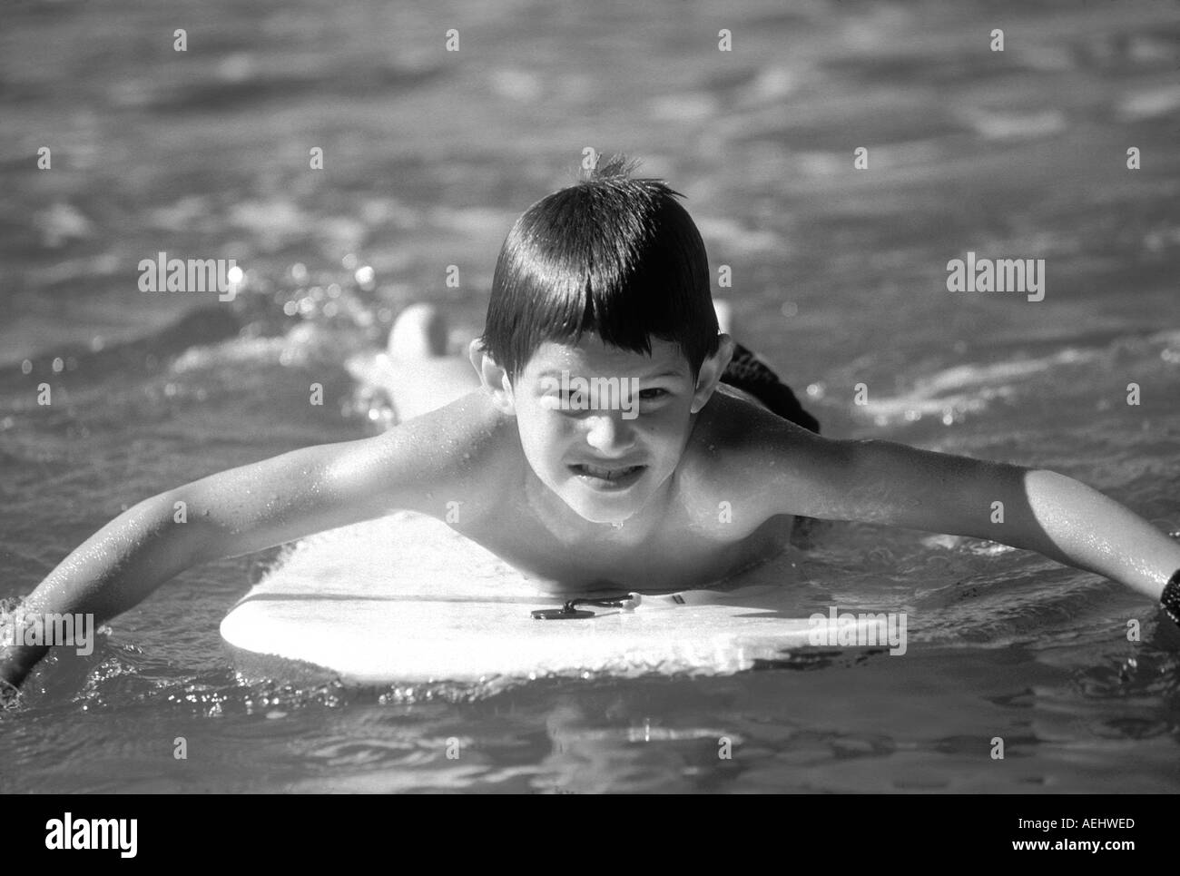 Surfing boy Black and White Stock Photos & Images - Alamy