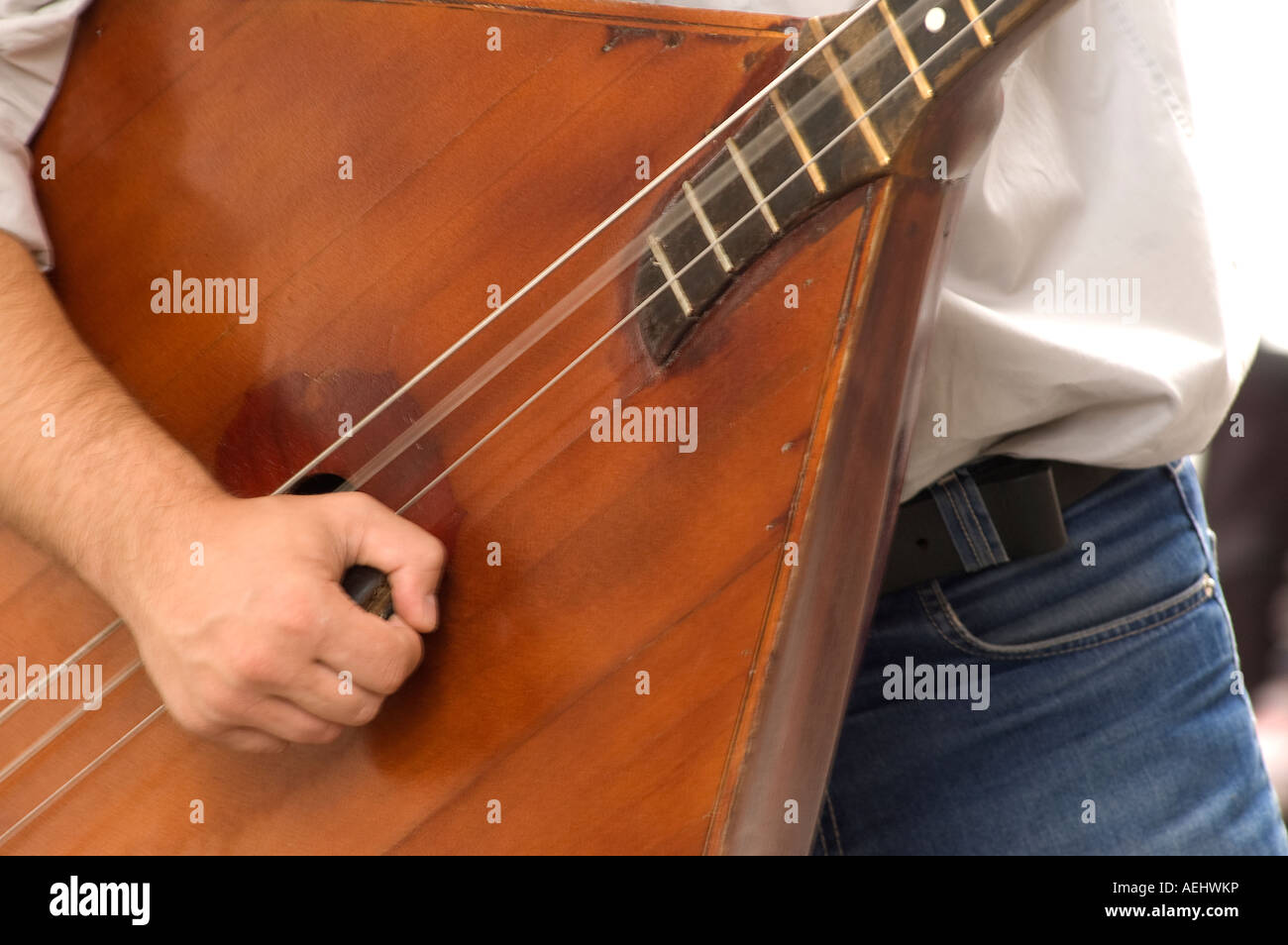 A musician play with an old bass instrument Stock Photo - Alamy