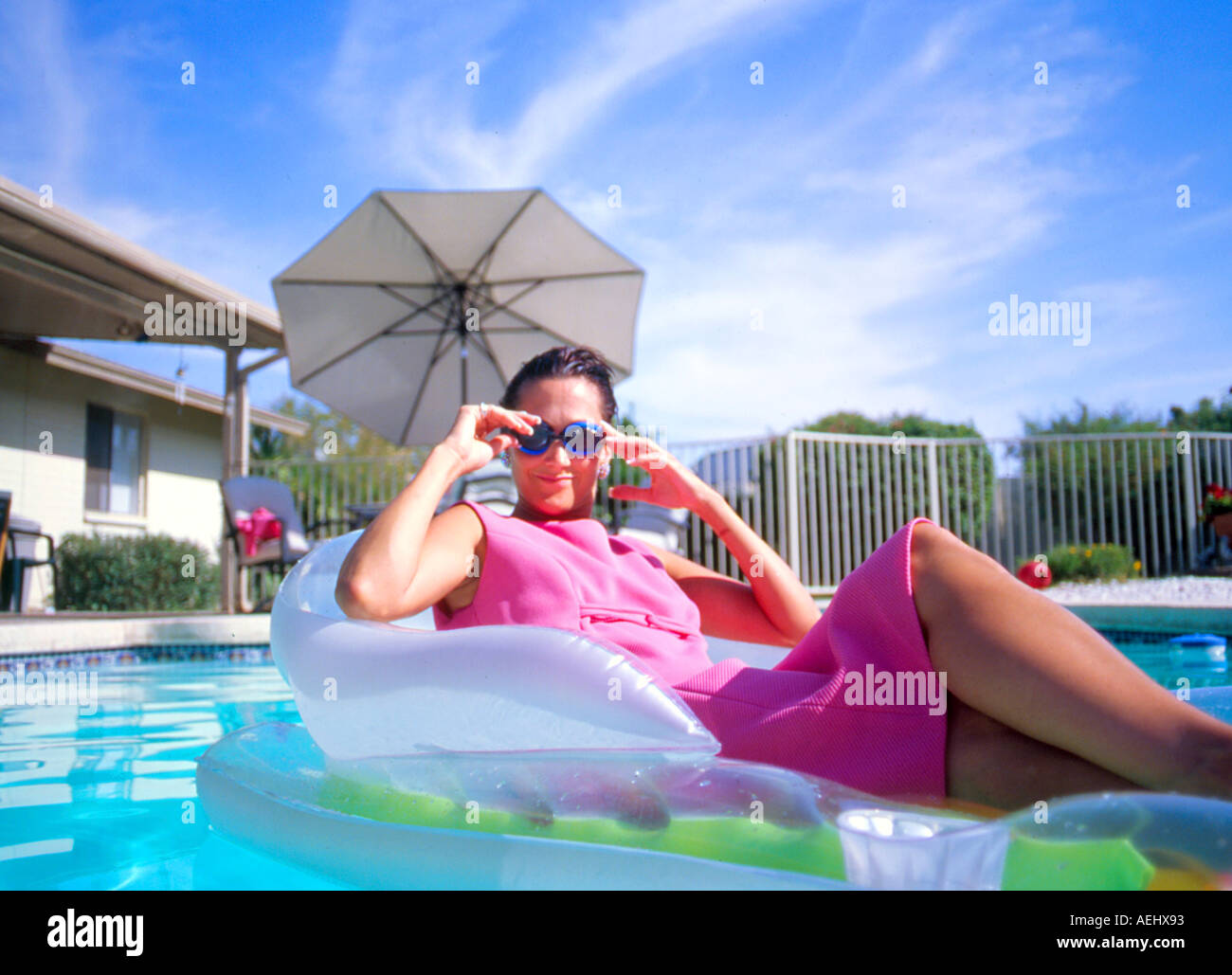 Woman in dress pool hi-res stock photography and images - Alamy