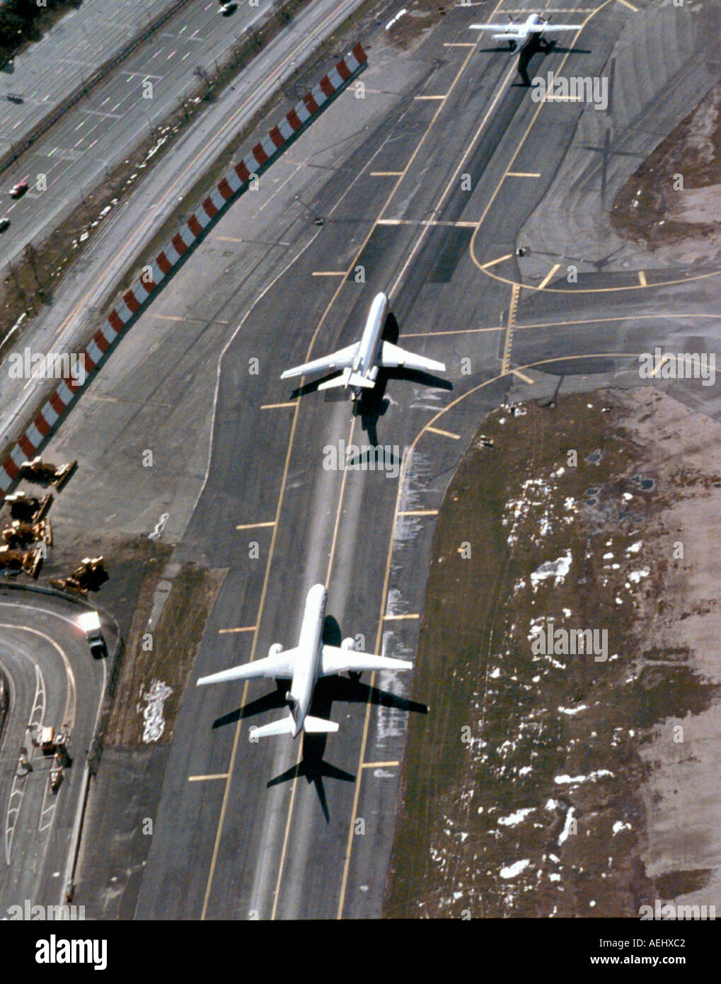 Airplanes lined up for runway Stock Photo - Alamy