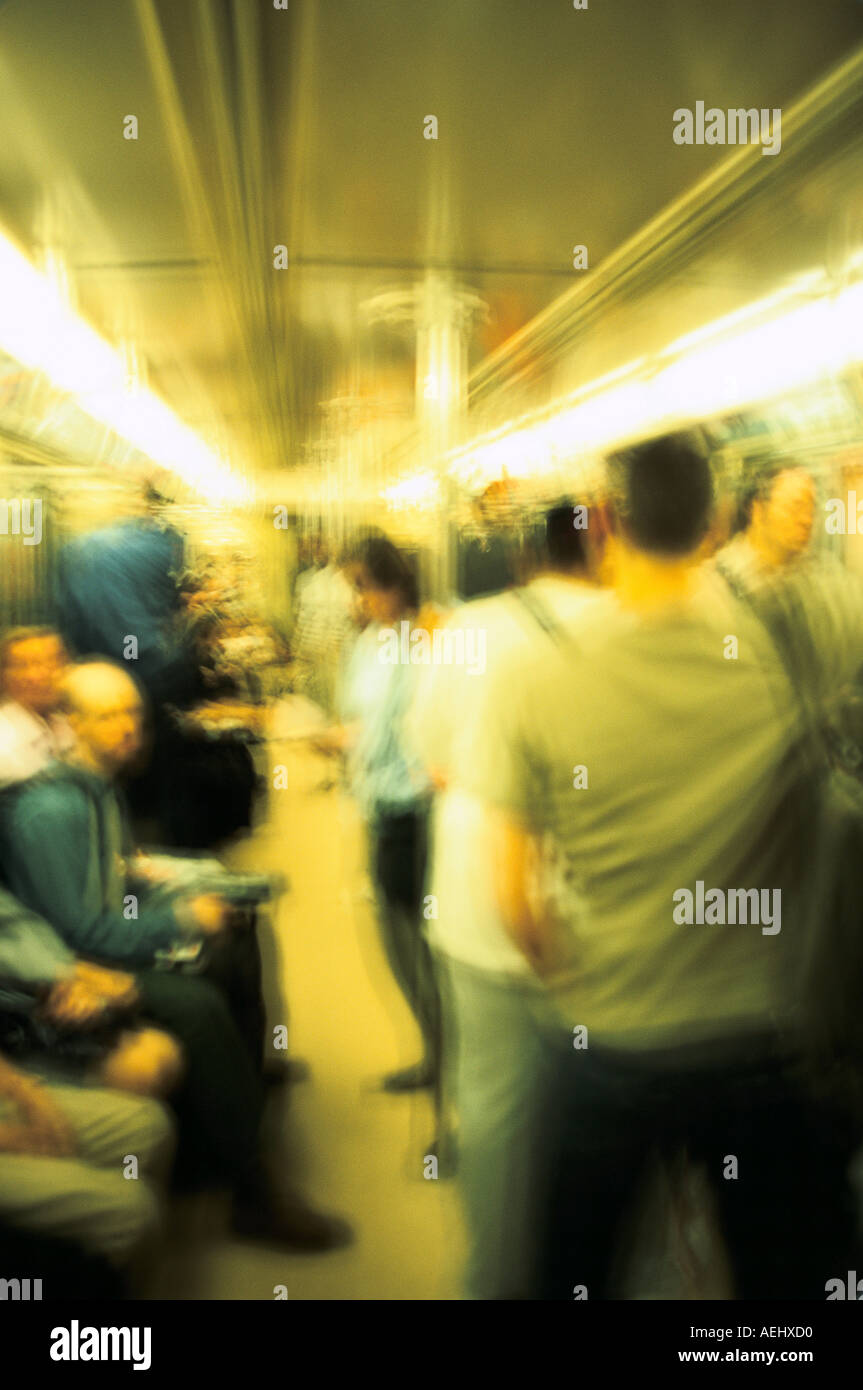 People standing in a subway train Stock Photo - Alamy