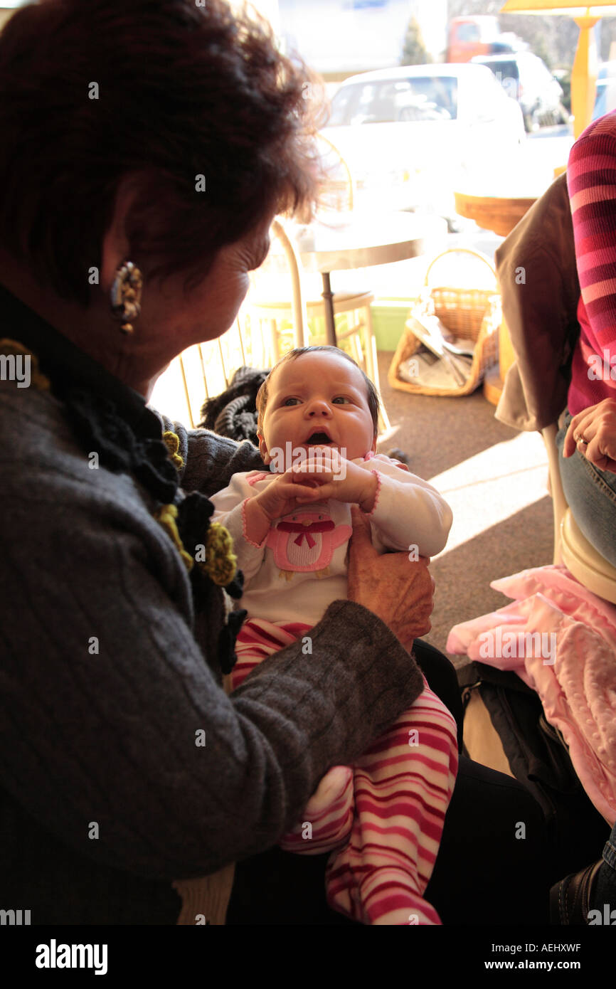 Baby being held by grandmother hi-res stock photography and images - Alamy