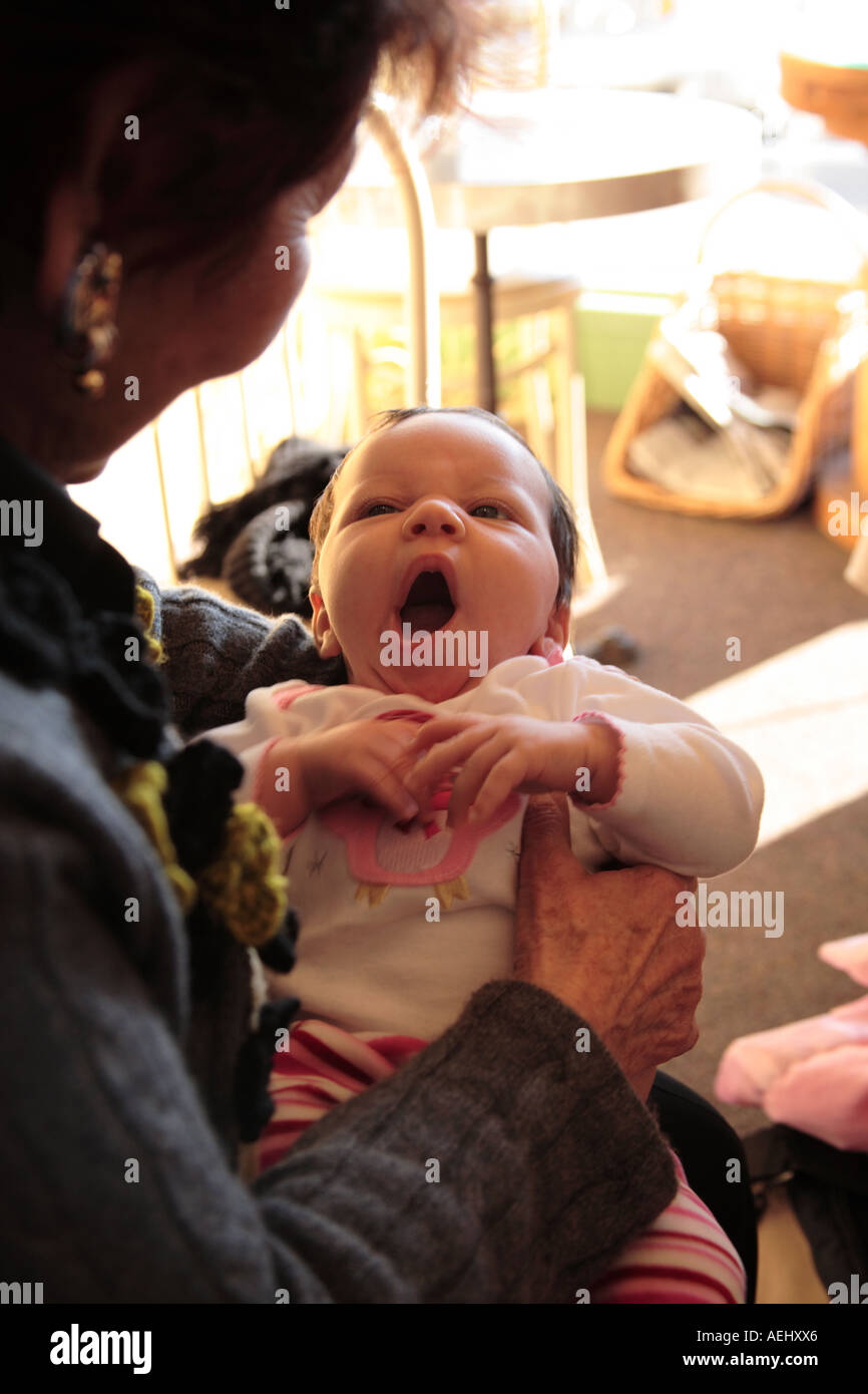 Infant Being Held Stock Photo - Alamy