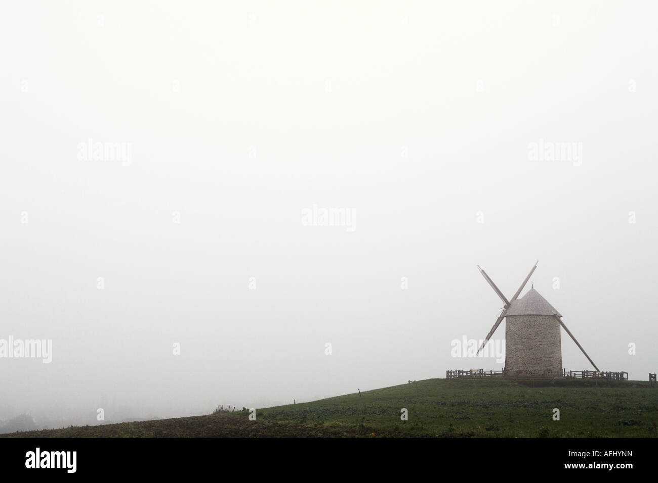 Small Windmill Perched Over Farmland, Near Mont Saint Michel Normandy ...