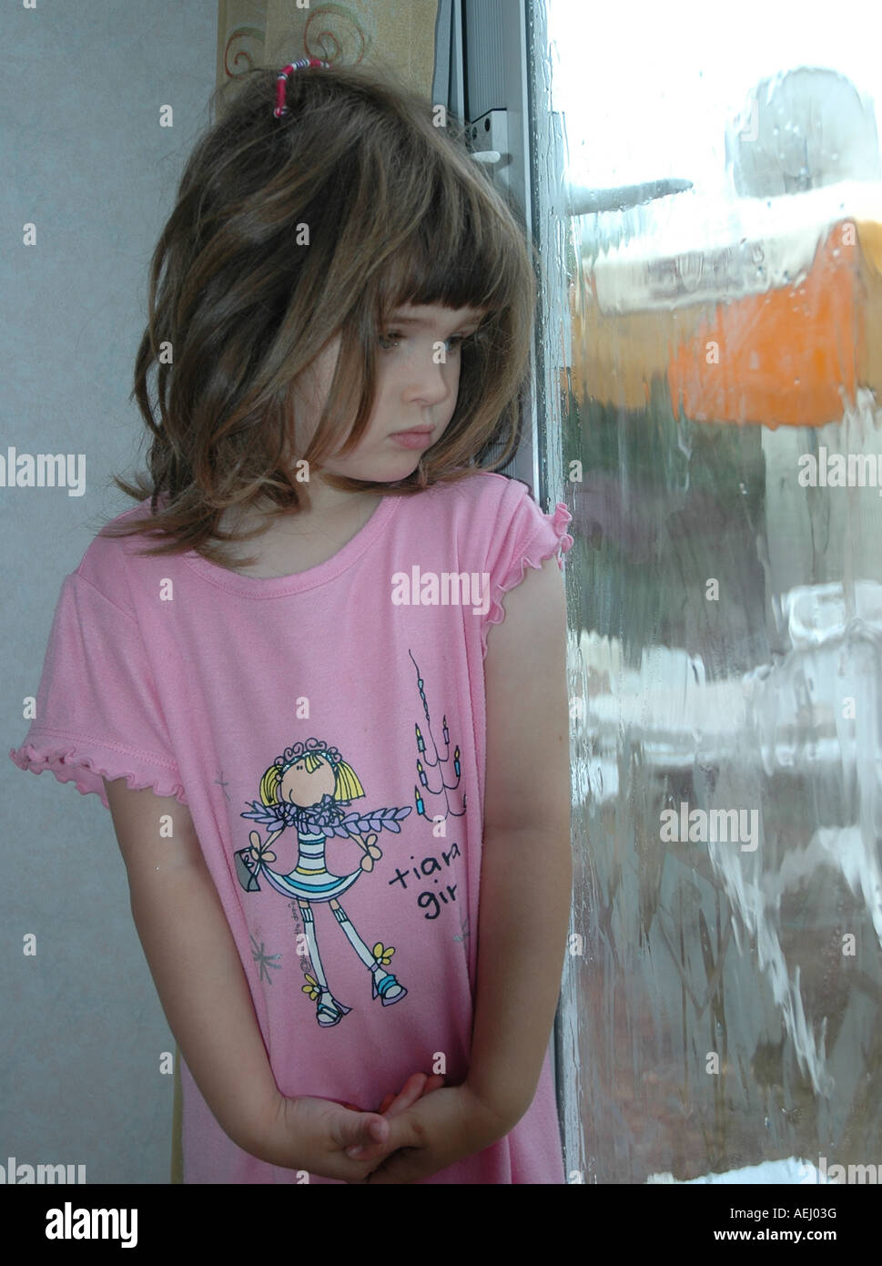 Small Girl Watching Rain Through Caravan Window Stock Photo - Alamy