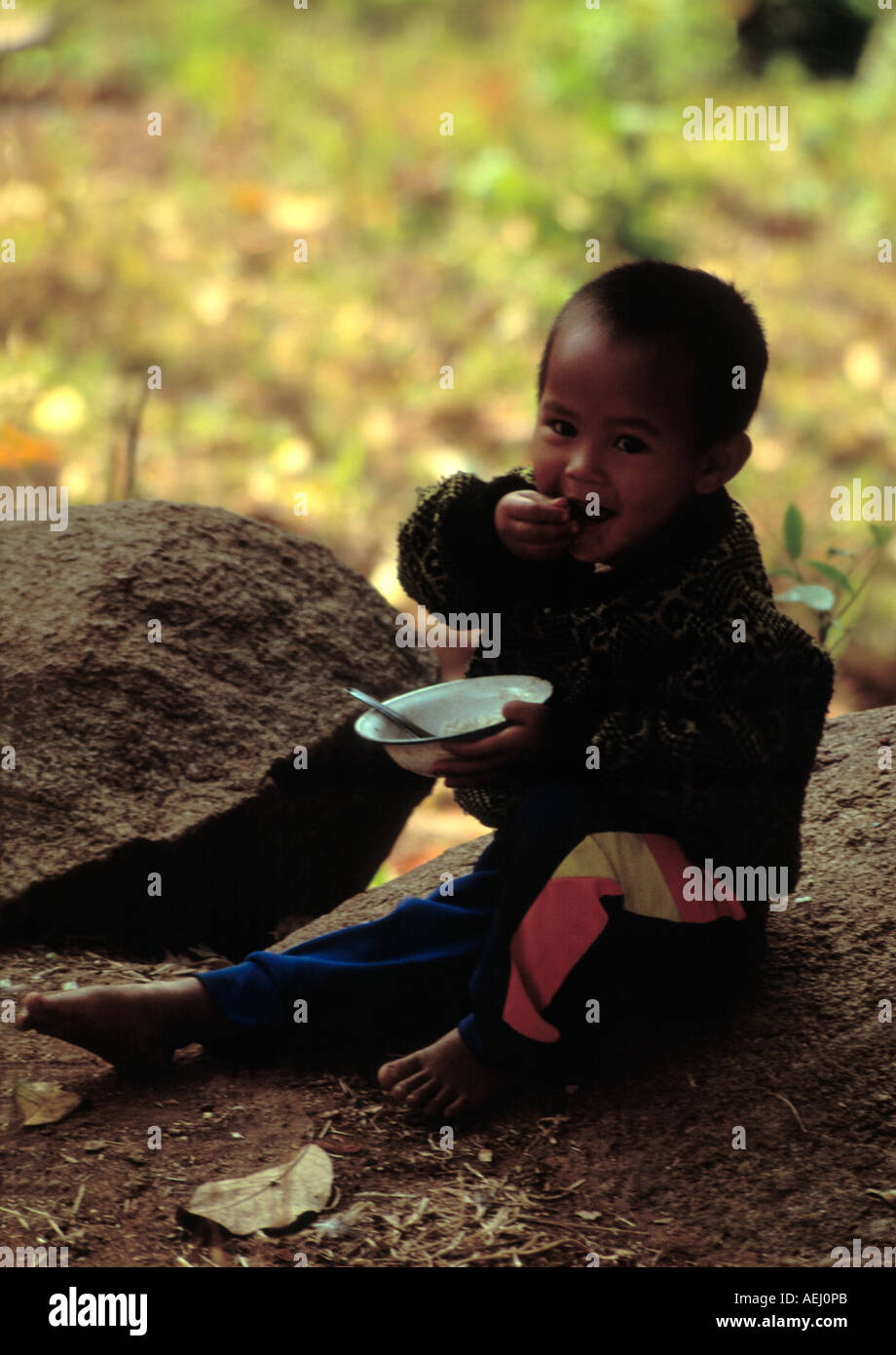 Child eating rice poverty hi-res stock photography and images - Alamy