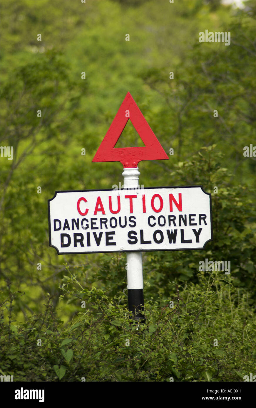 Caution dangerous corner drive slowly hi-res stock photography and ...