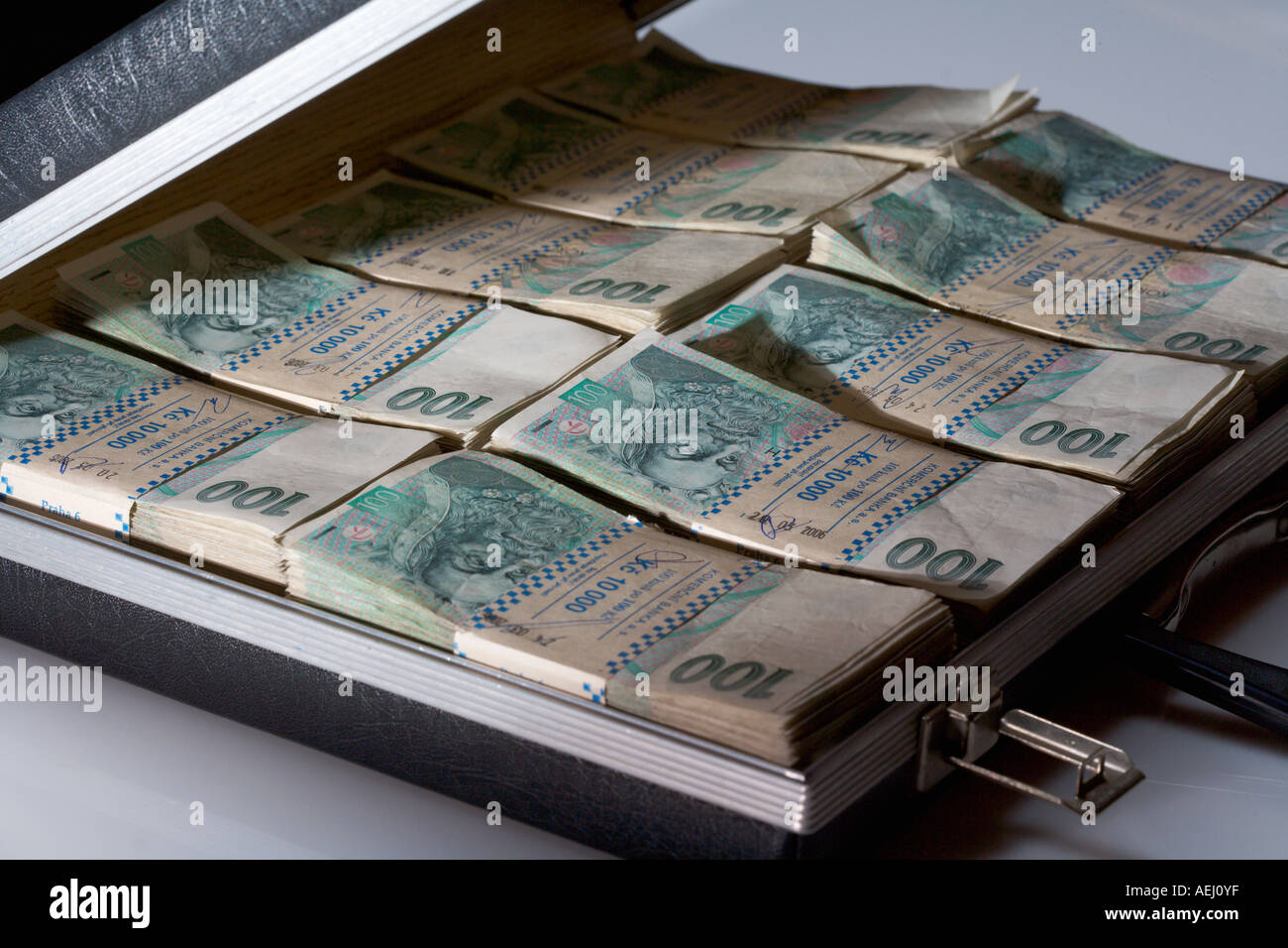 Briefcases money hi-res stock photography and images - Alamy