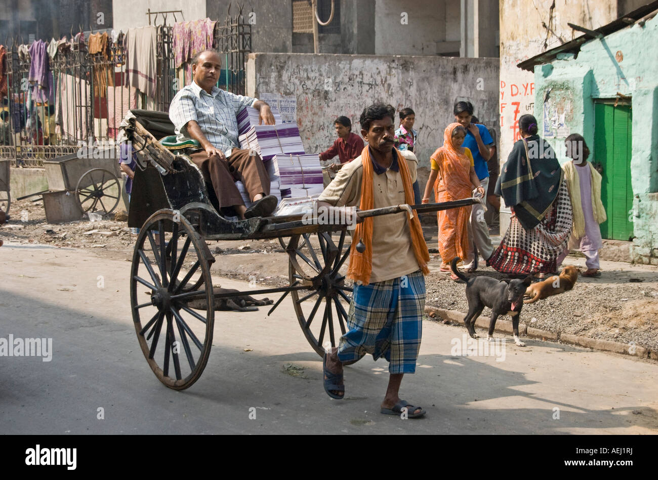 In Kolkata the rickshaws are still pulled by a man on foot like it was ...