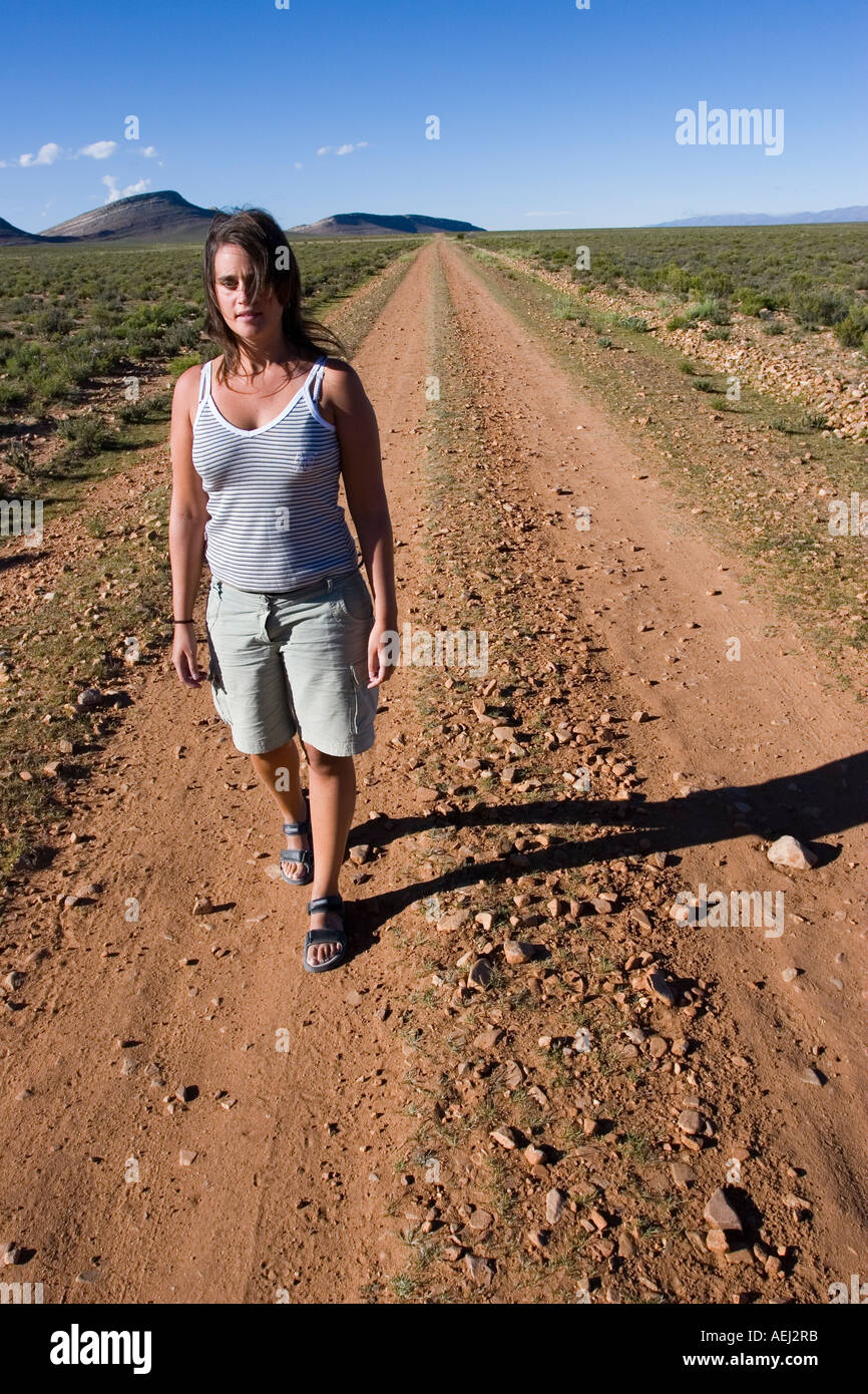 People walk along dirt road hi-res stock photography and images - Alamy