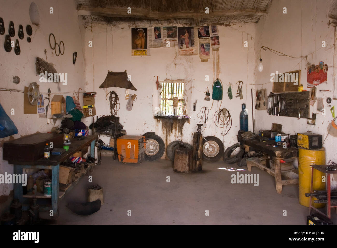 A small car repairing workshop garage taller mecánico in a middle of a ...
