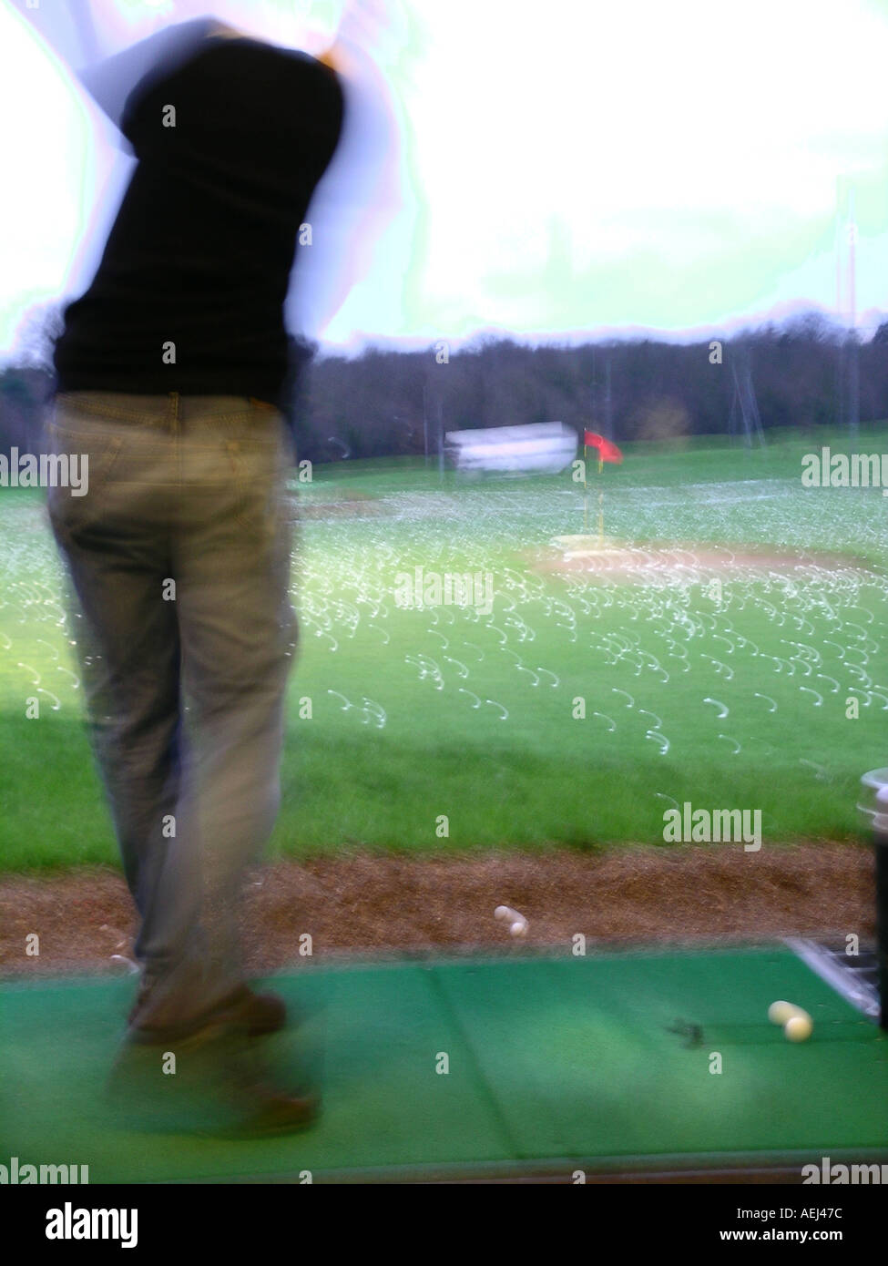 golfer on driving range Stock Photo - Alamy