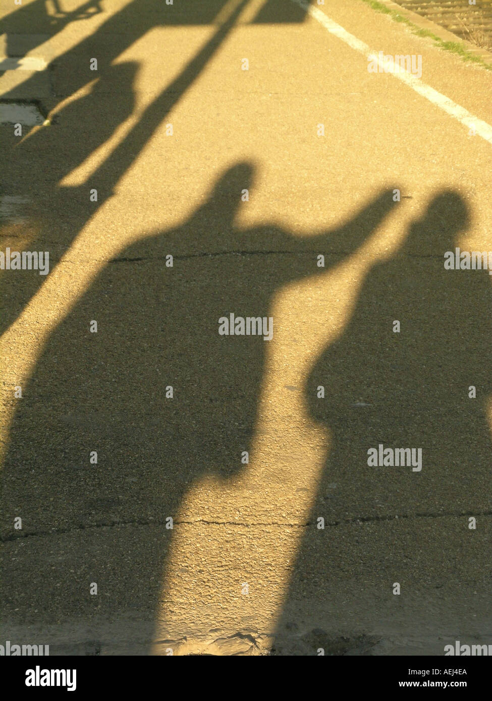 shadow of bully attacks shadow of boy Stock Photo - Alamy