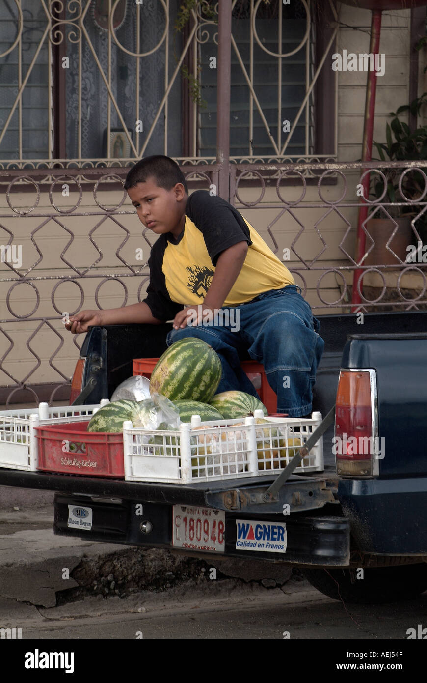 Costa Rican boy selling watermelon in a street, Costa Rica Stock Photo ...