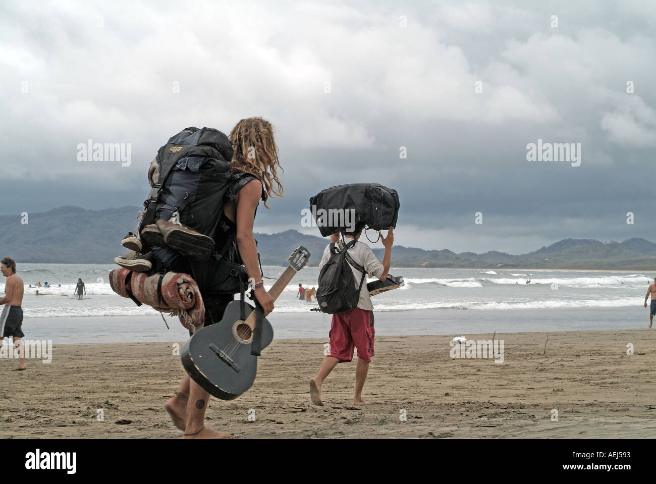 Musicians walking on Tamarindo beach, Costa Rica Stock Photo - Alamy