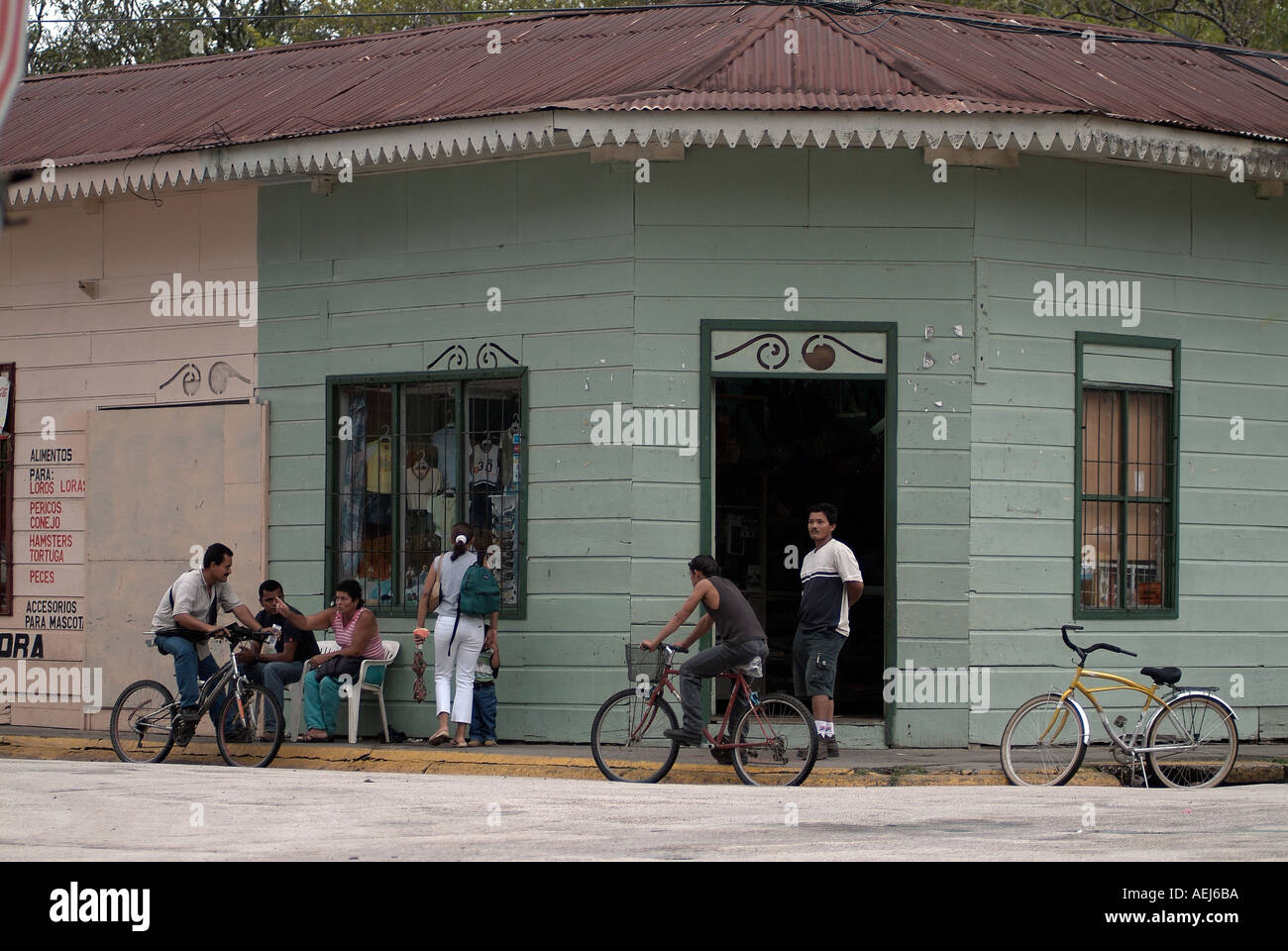 Costa Rican people talking in front of a house Stock Photo - Alamy