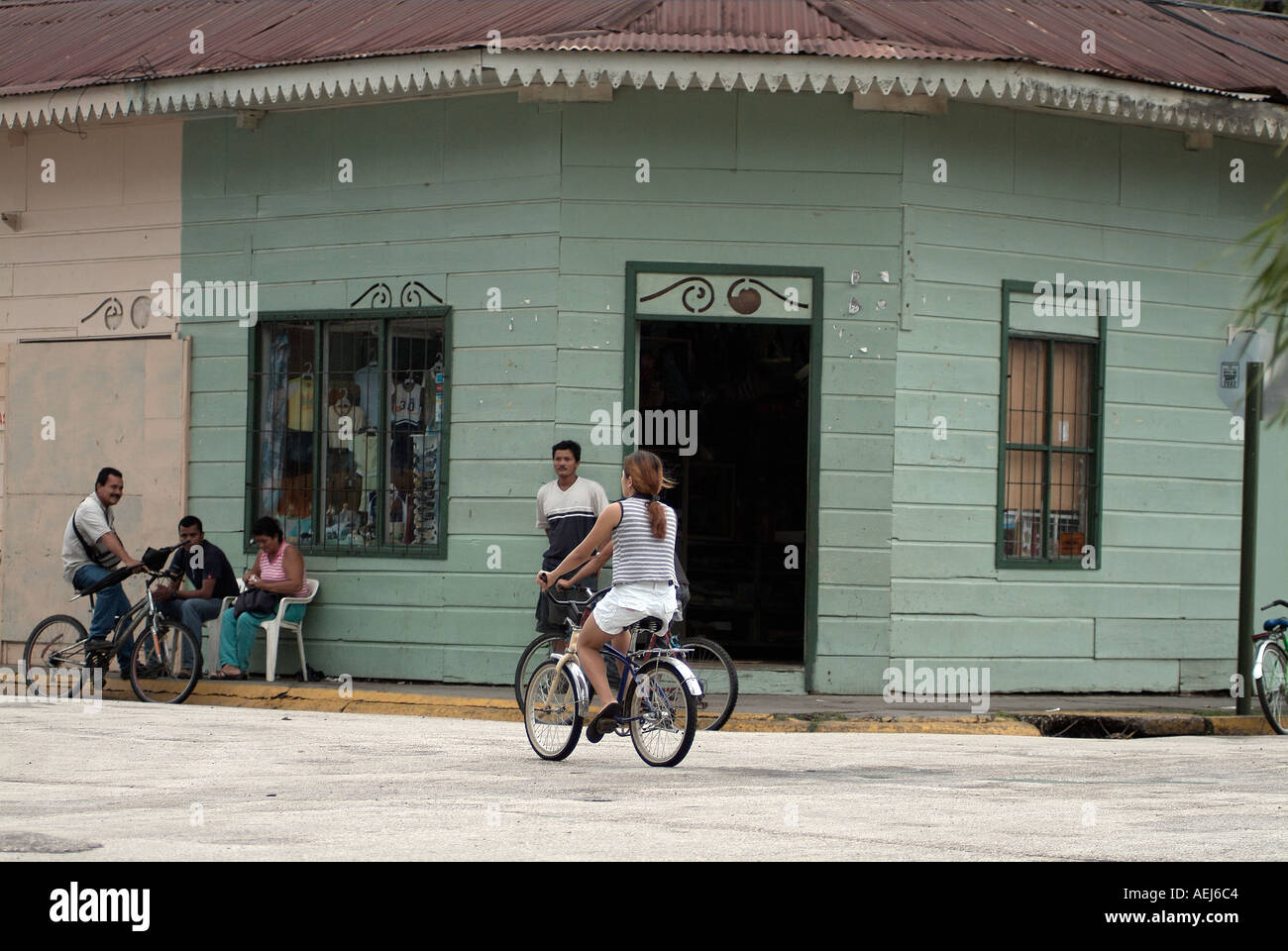 Costa Rican people talking in front of a house Stock Photo - Alamy