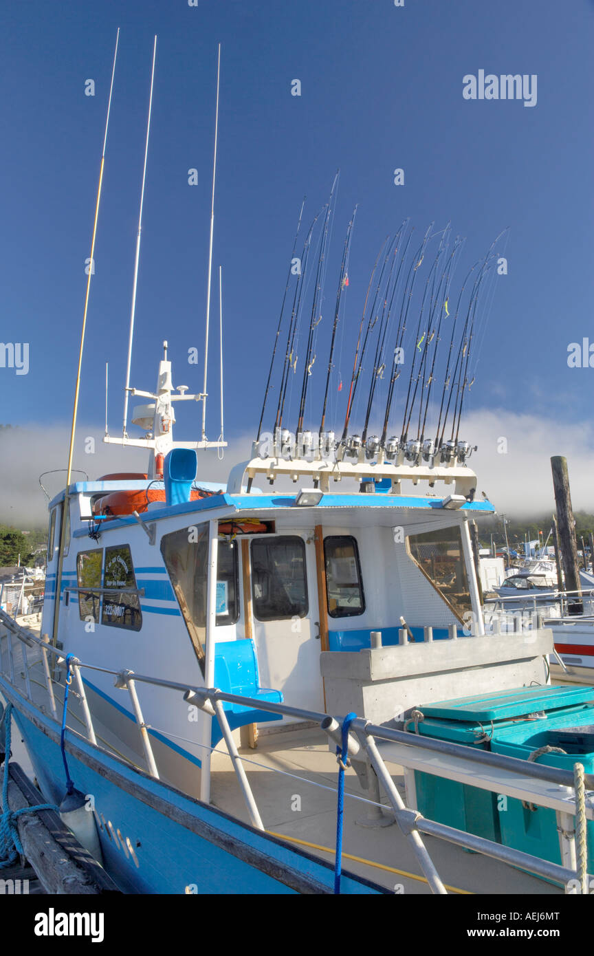 Fishing poles on sport fishing boat Garibaldi boat harbor Oregon Stock ...