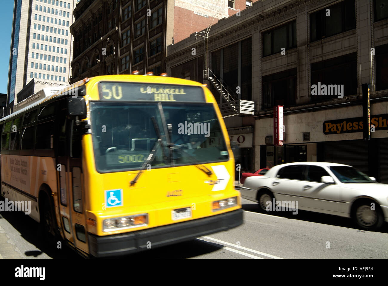 Yellow bus in downtown of Dallas, Texas Stock Photo - Alamy