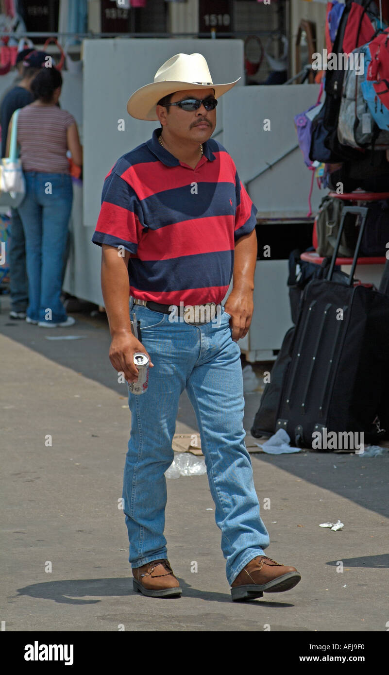 Texan man walking in the street Stock Photo - Alamy