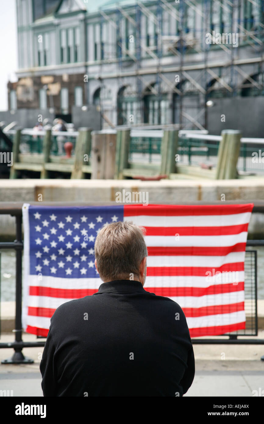 Man sitting in front of the USA flag, Manhattan, New York, USA Stock ...