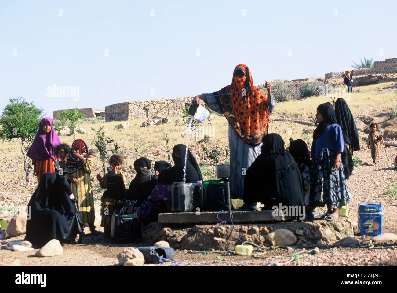 Women at water well on socotra island Yemen Stock Photo - Alamy