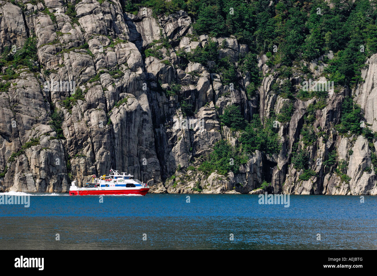 Ship navigating along rock face, Lysefjord, Rogaland, Norway Stock ...