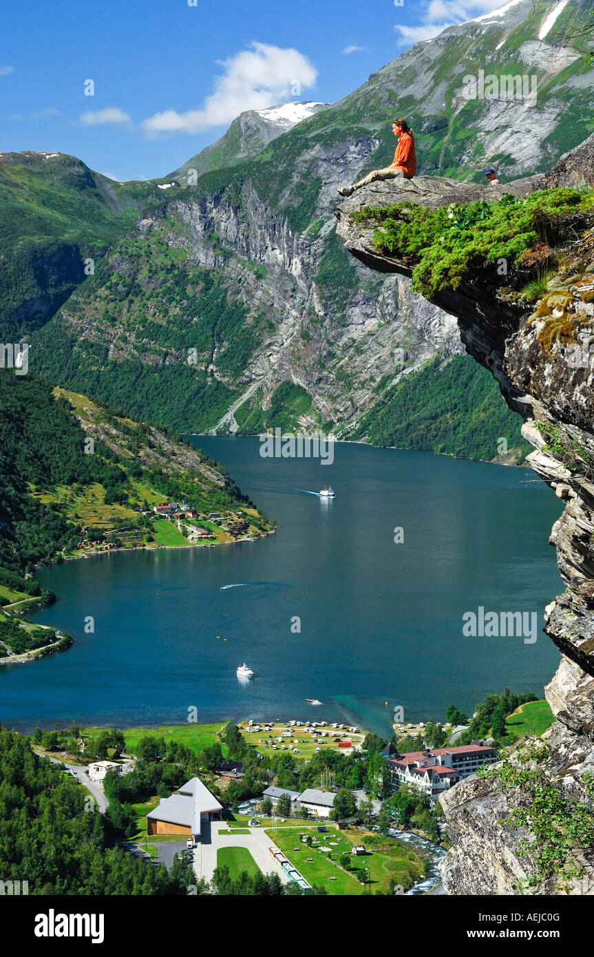 Woman is sitting on a ledge, Geirangerfjord, Norway, Scandinavia Stock ...
