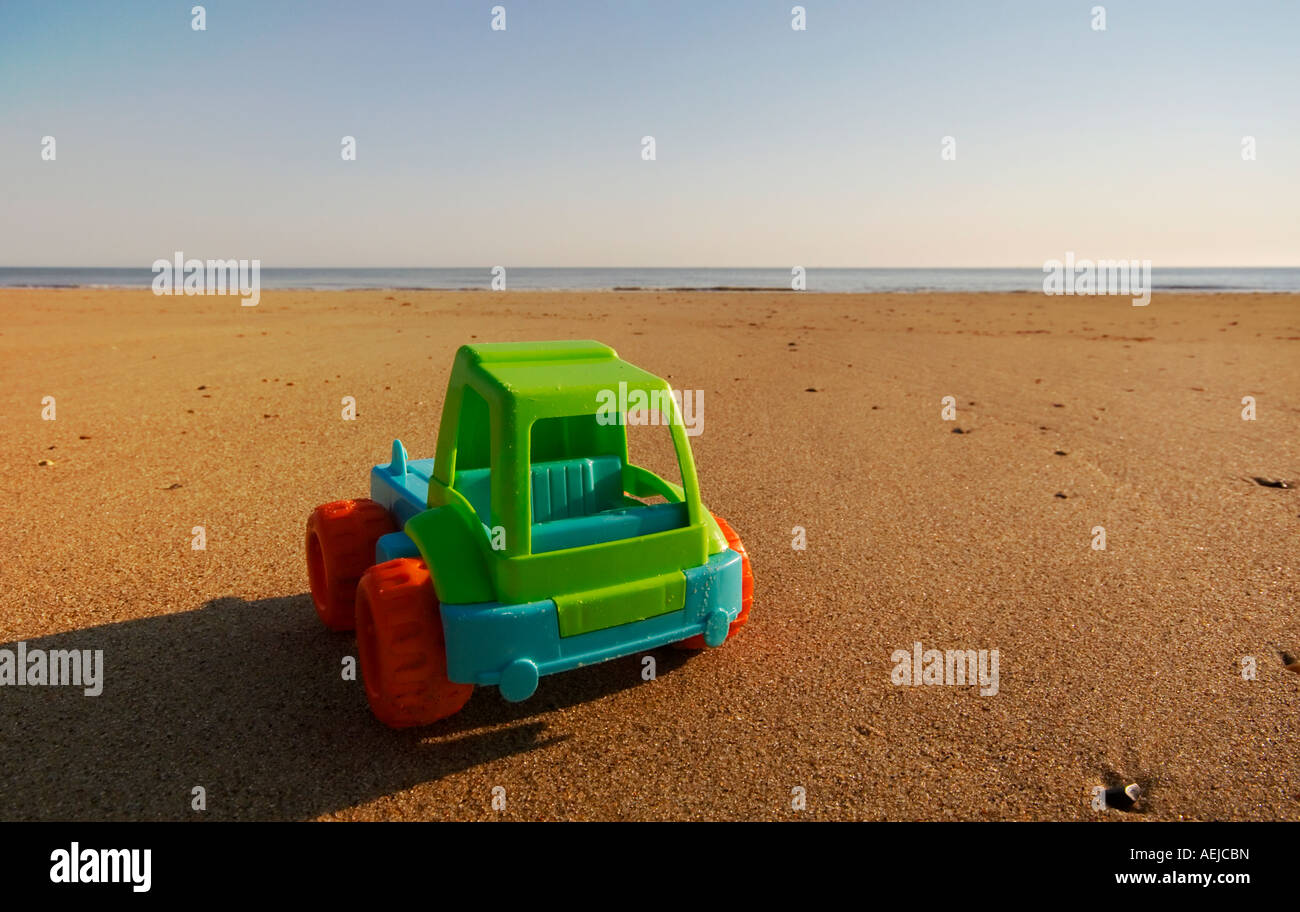 A childs toy left behind on Mundesley Beach Stock Photo - Alamy