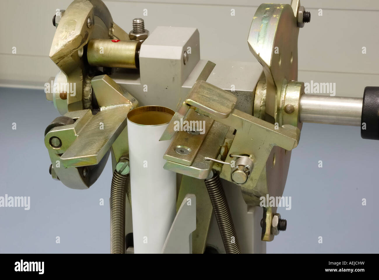 Device for the crimping of aluminium tubes Stock Photo - Alamy